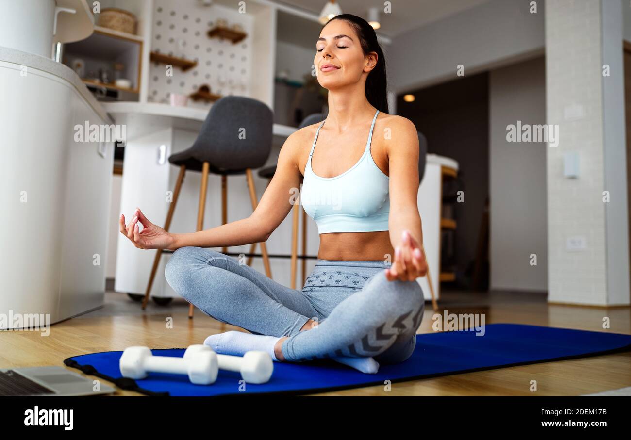 Fitness, sport home and diet concept. Happy fit woman exercising at ...