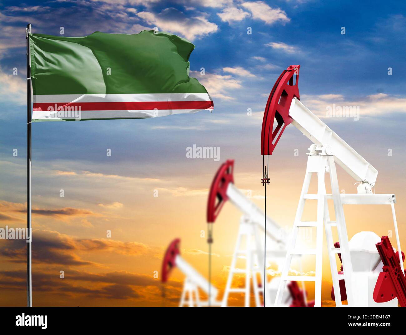 Oil rigs against the backdrop of the colorful sky and a flagpole with ...