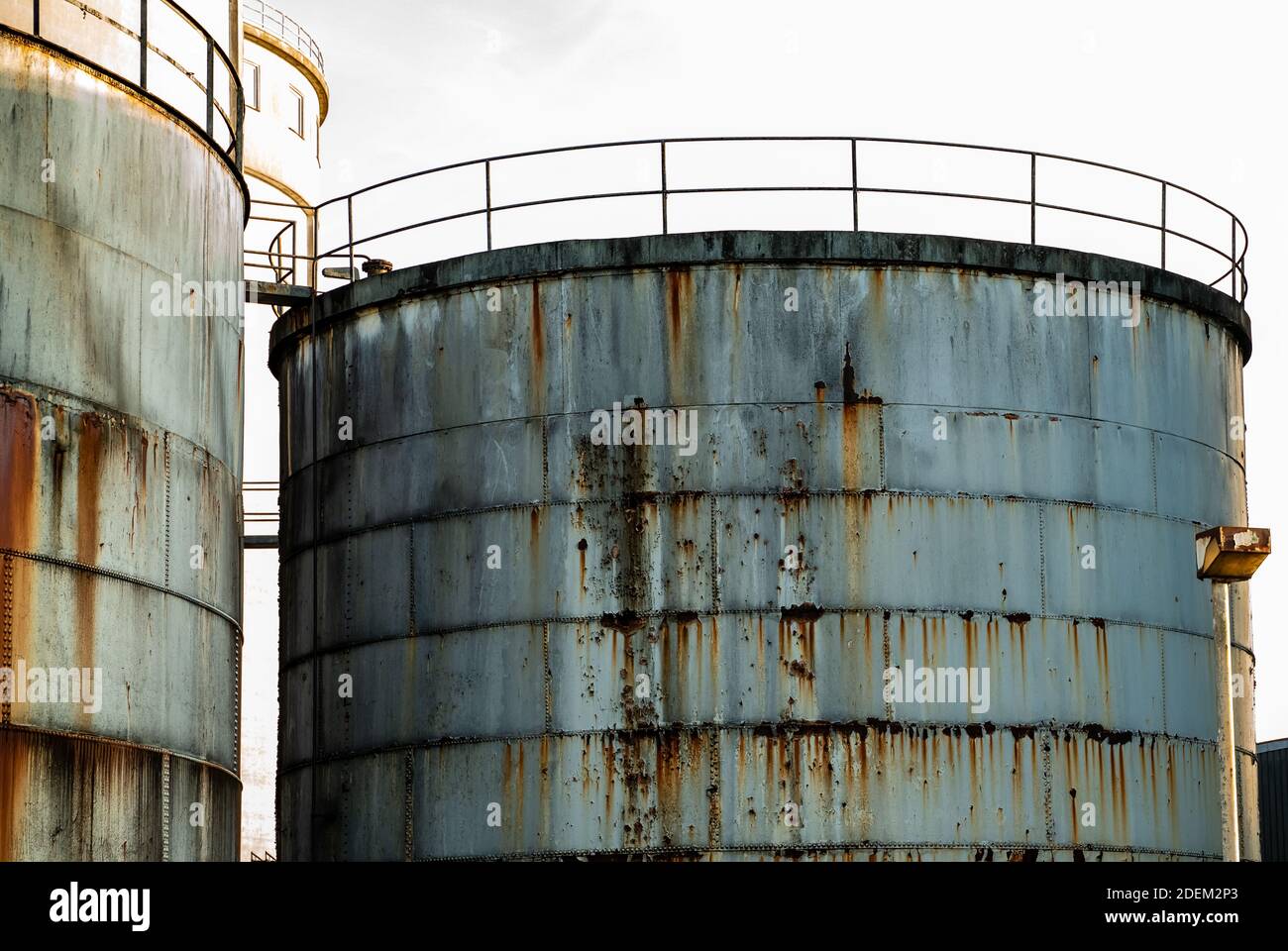 Old and rusted steel silos for storage of solids and liquids Stock ...