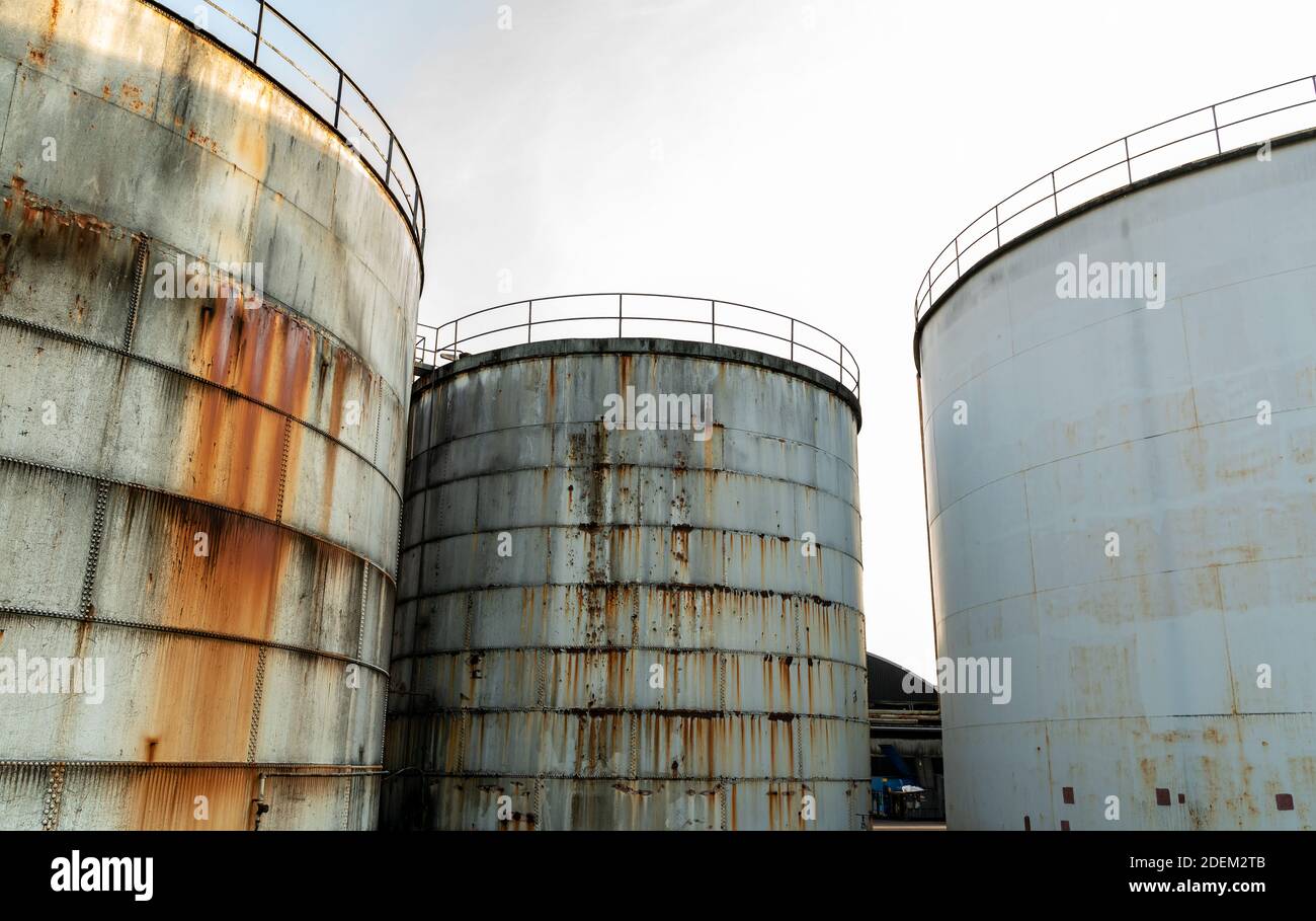 Old and rusted steel silos for storage of solids and liquids Stock ...