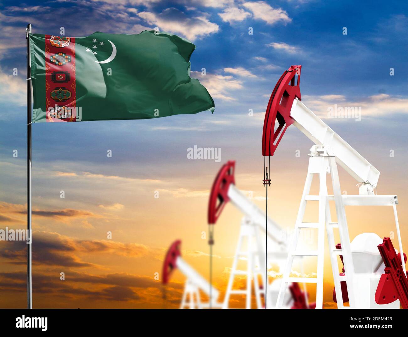 Oil rigs against the backdrop of the colorful sky and a flagpole with ...