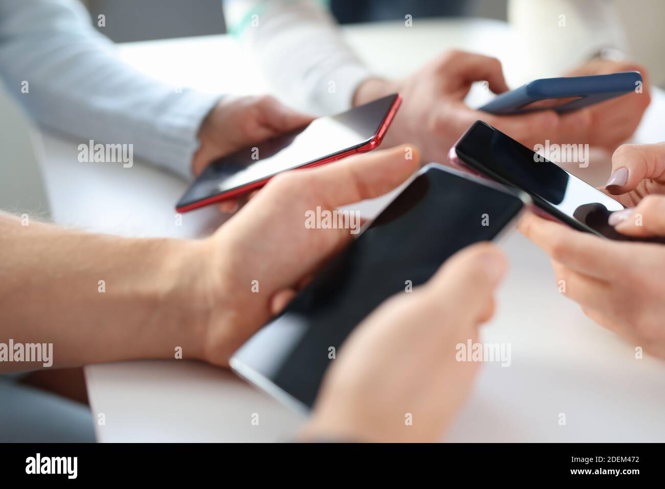Group of business people are holding mobile phones in office Stock ...