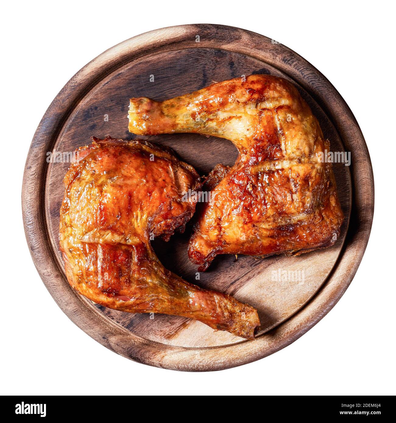 Chicken leg quarters on a wooden cutting board isolated on white, top ...