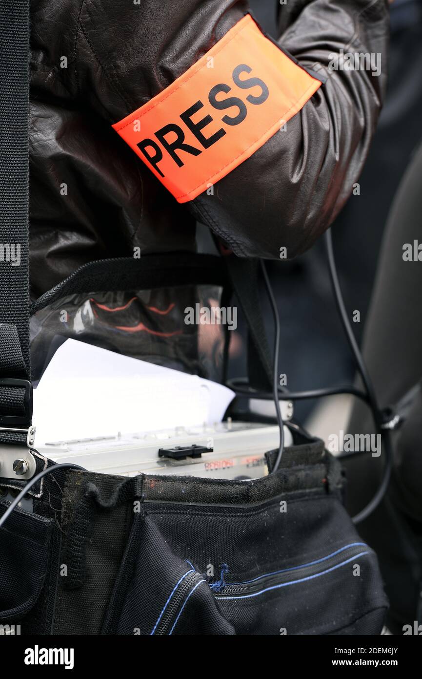 Journalist Reporter wearing a press harmband in interview during a ...