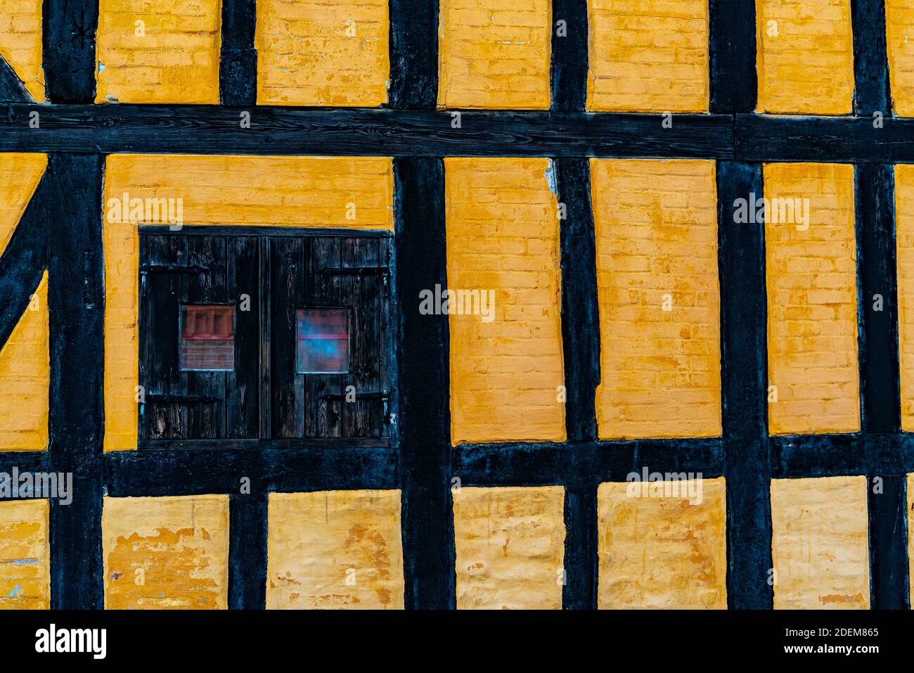 Facade of an old half timbered medieval house in northern Europe, with ...