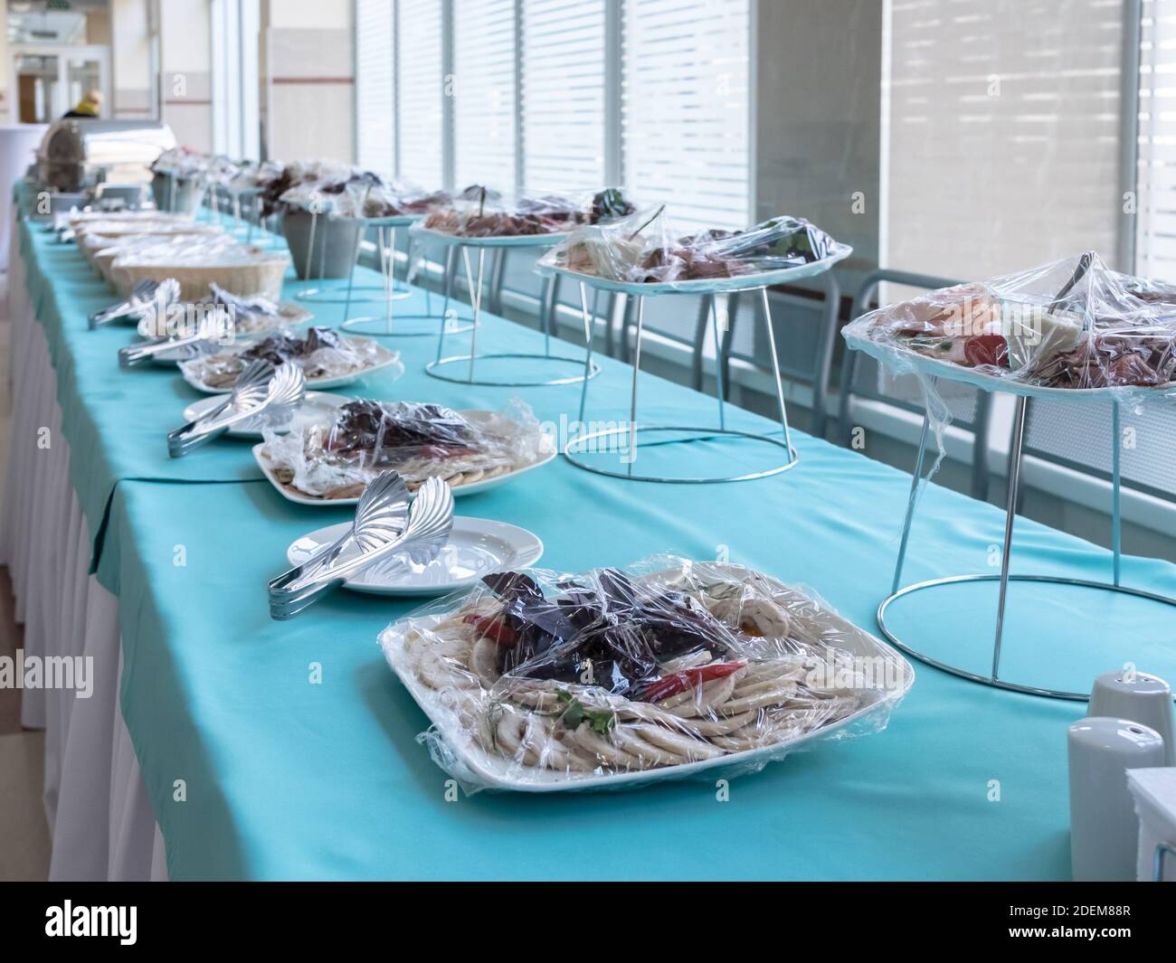 Dishes are served to the table for the holiday. Cutlery and food on ...