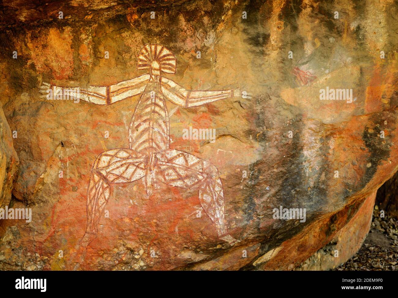Ancient aboriginal painting of man art on huge rock stone in Kakadu ...