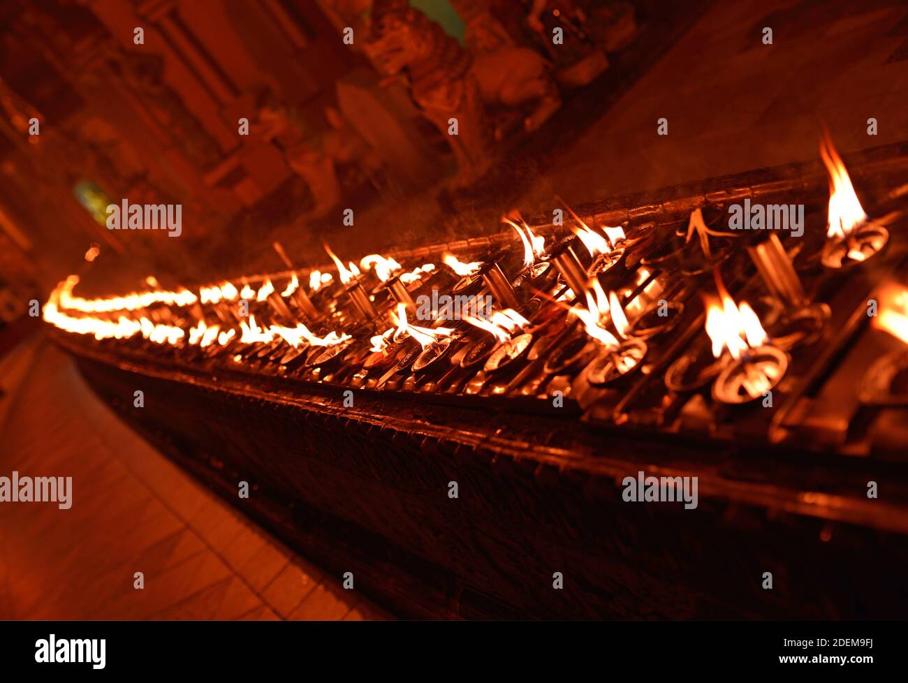 Faithful burning candles in Shwegadon pagoda in Yangon, Myanmar (former ...