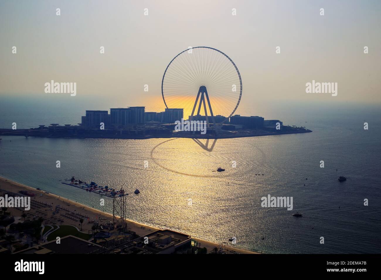 Ferris wheel and Bluewaters island in backlight, sunset, with sun ...