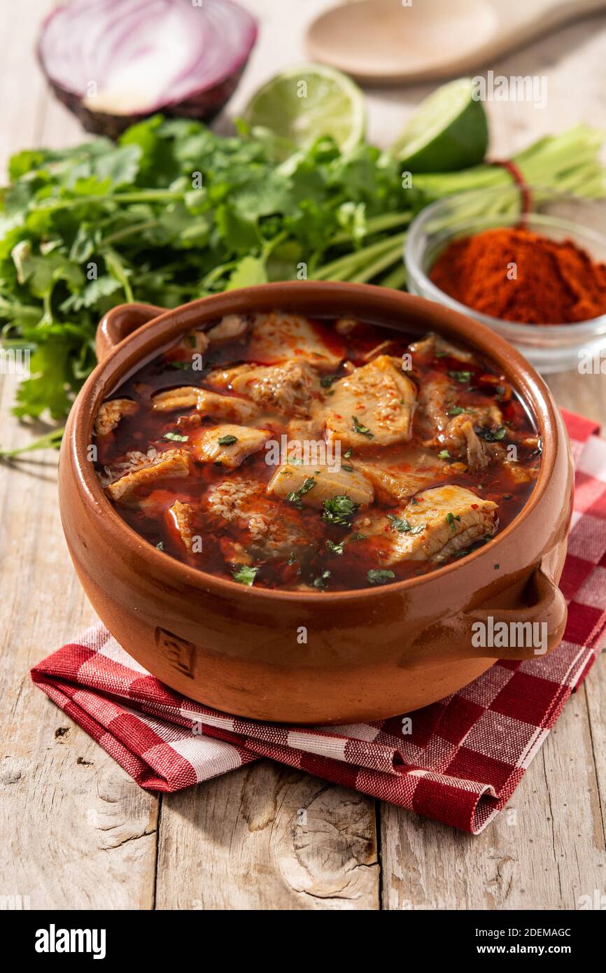 Traditional mondongo or el menudo soup on wooden table Stock Photo - Alamy