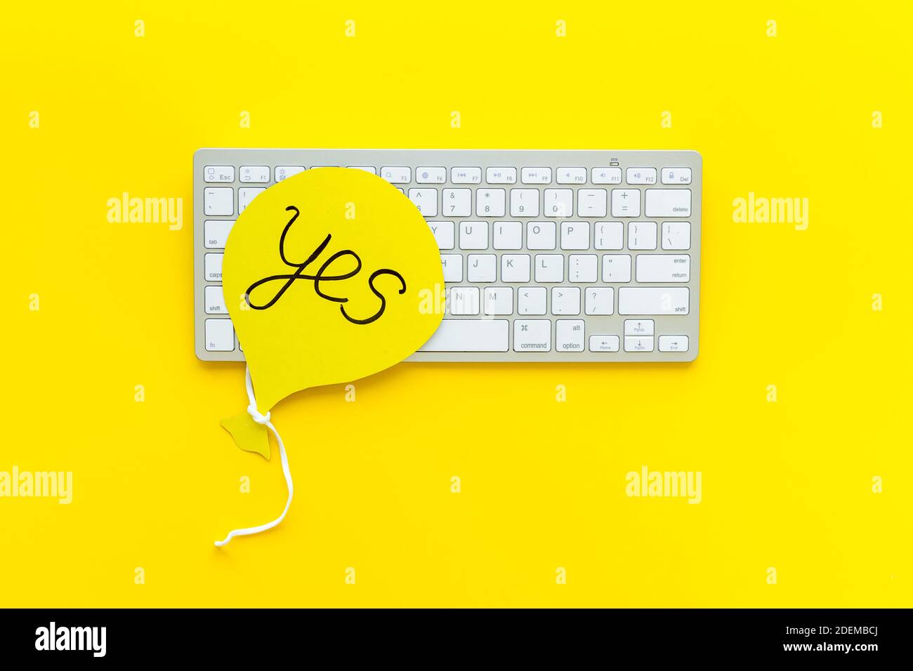Yes agreement - decision concept. Word Yes on the keyboard, top view ...