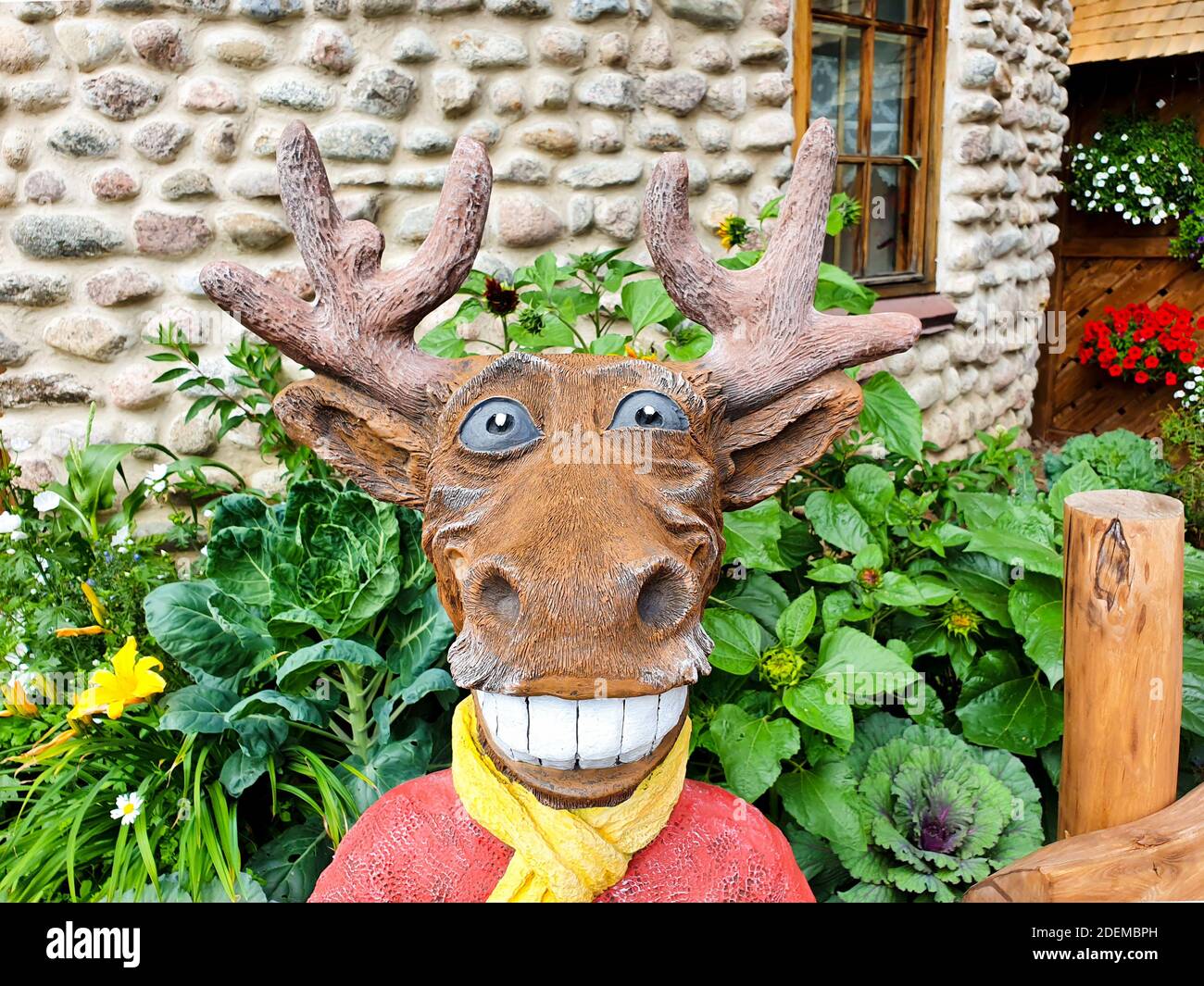 Smiling deer face sculpture. Portrait, front view Stock Photo - Alamy