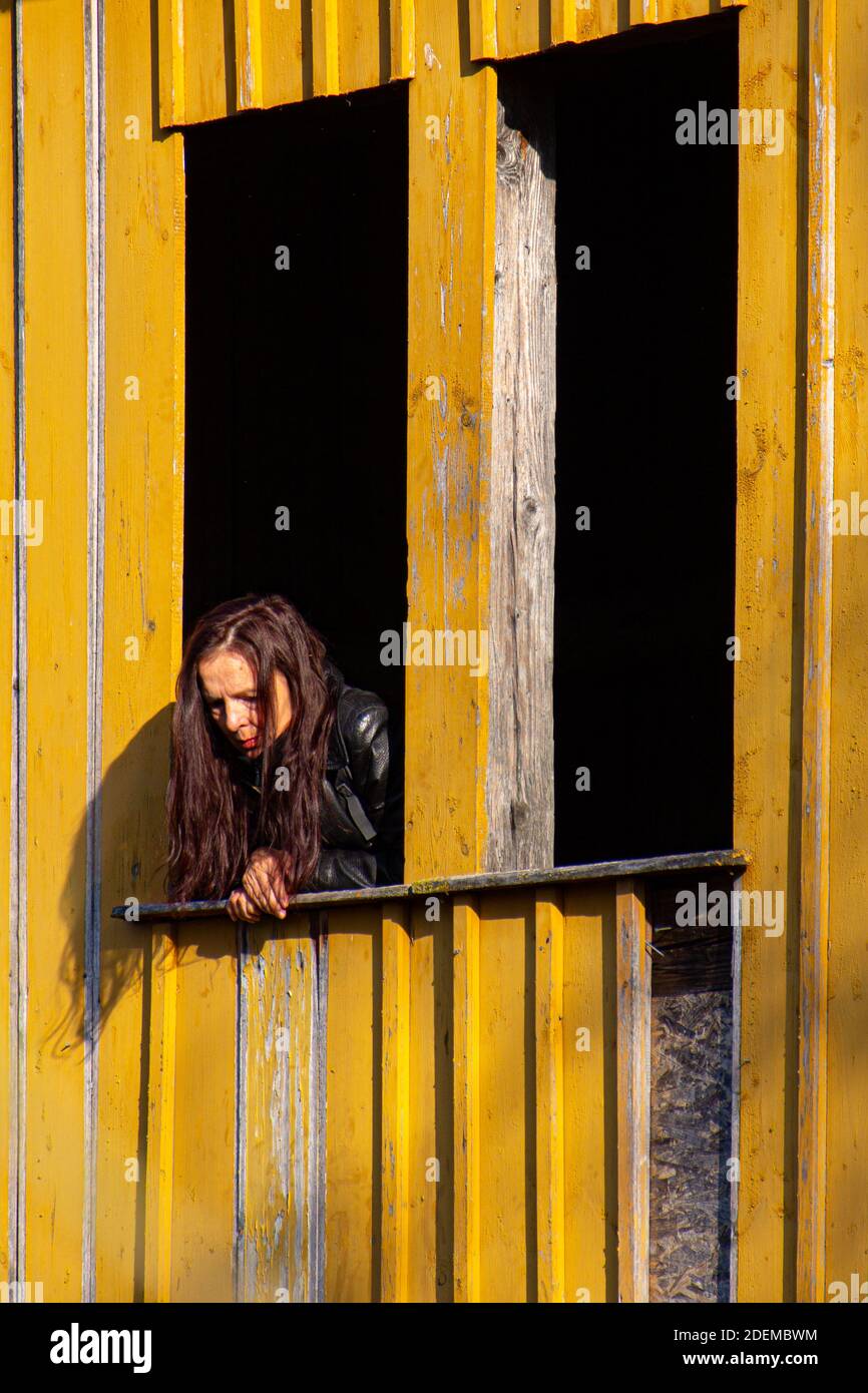 Lean out of window hi-res stock photography and images - Alamy