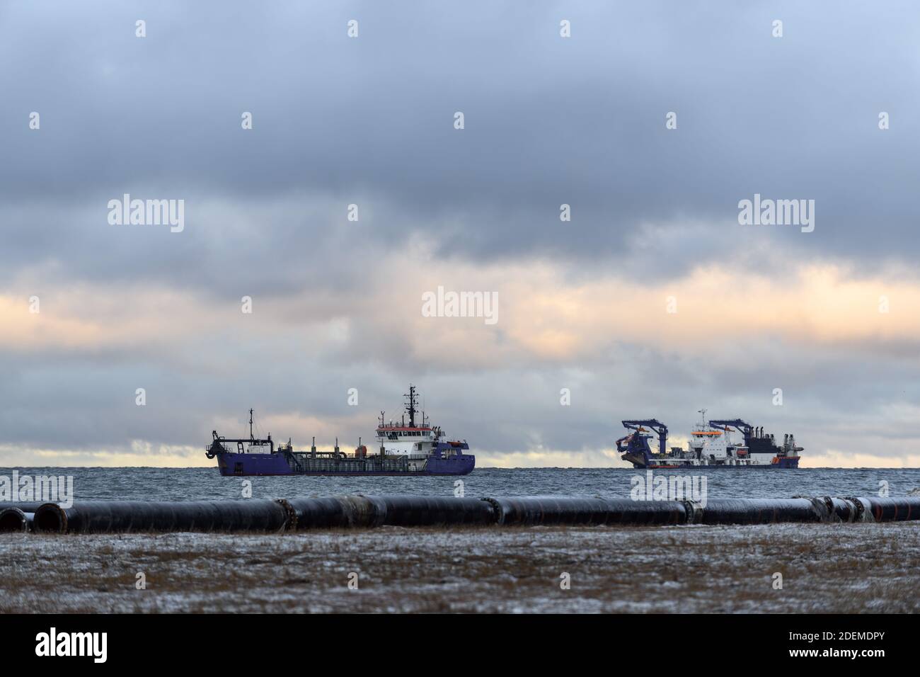 Vessel engaged in dredging. Dredger working at sea. Ship excavating ...