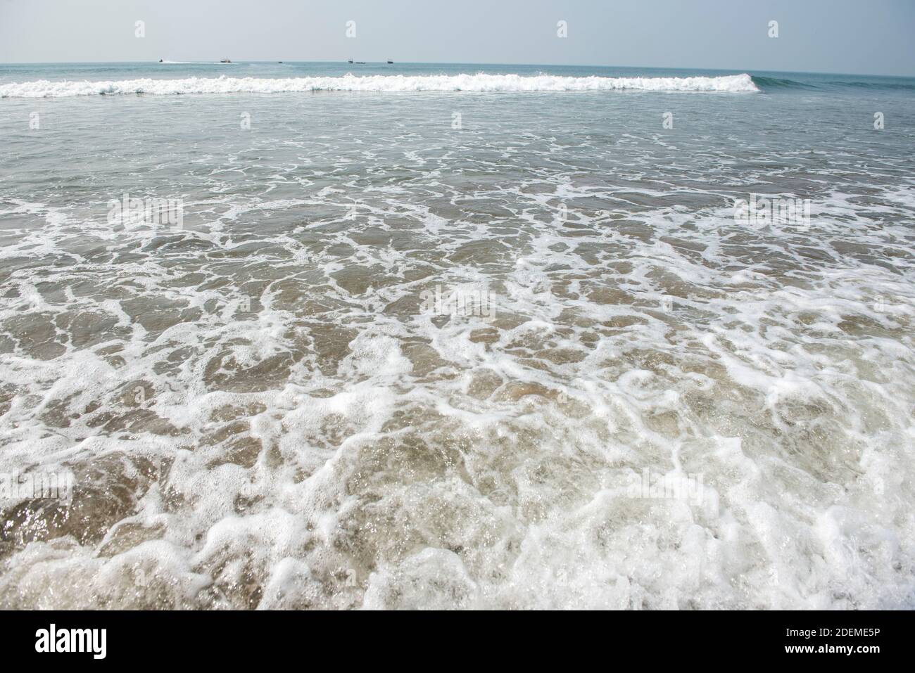 Goa/ India 09 November 2020 Sea waves crashing on sandy beach at Baga ...