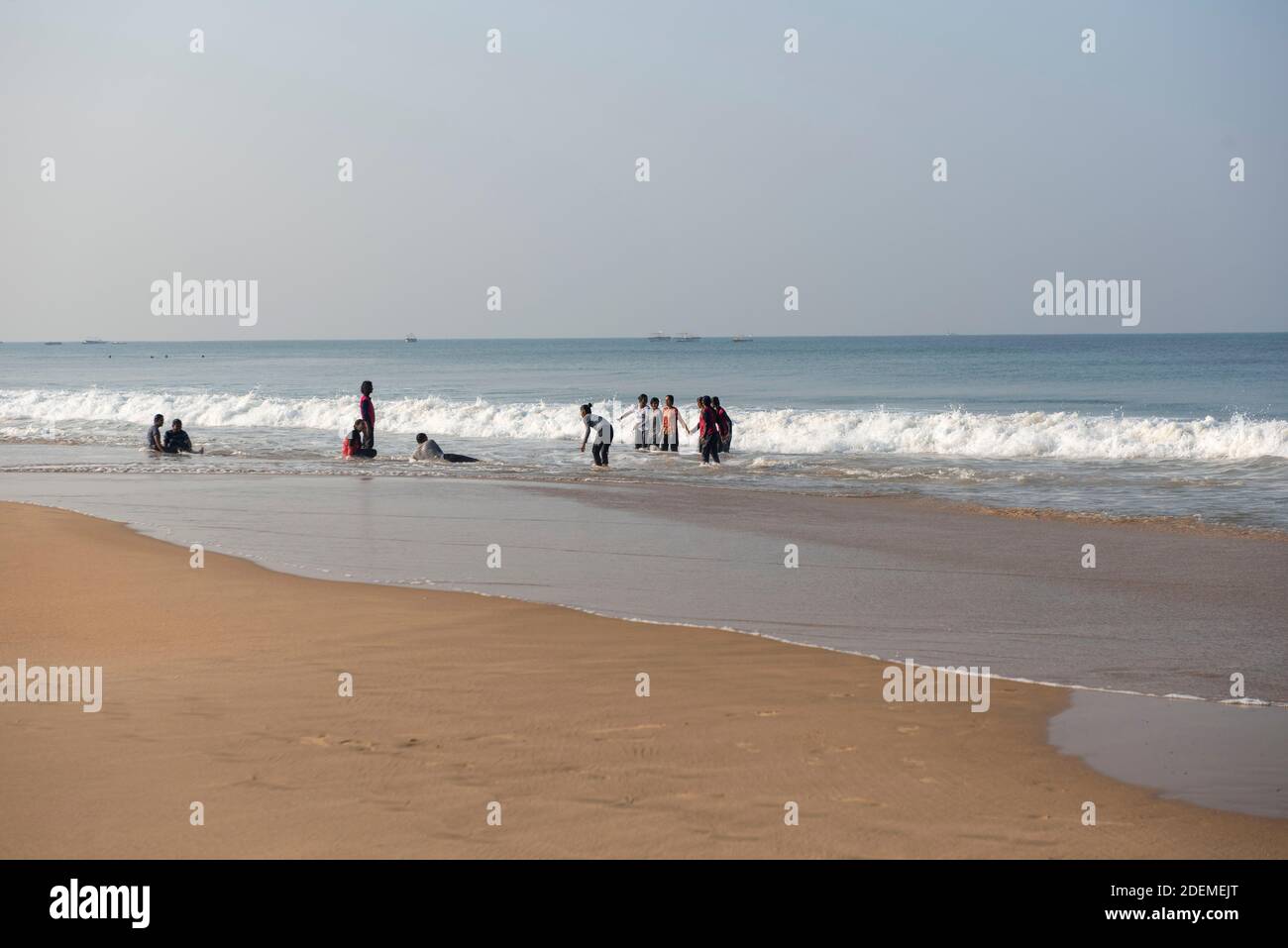 Goa/ India 09 November 2020 People Bathing On Beach white ocean waves ...