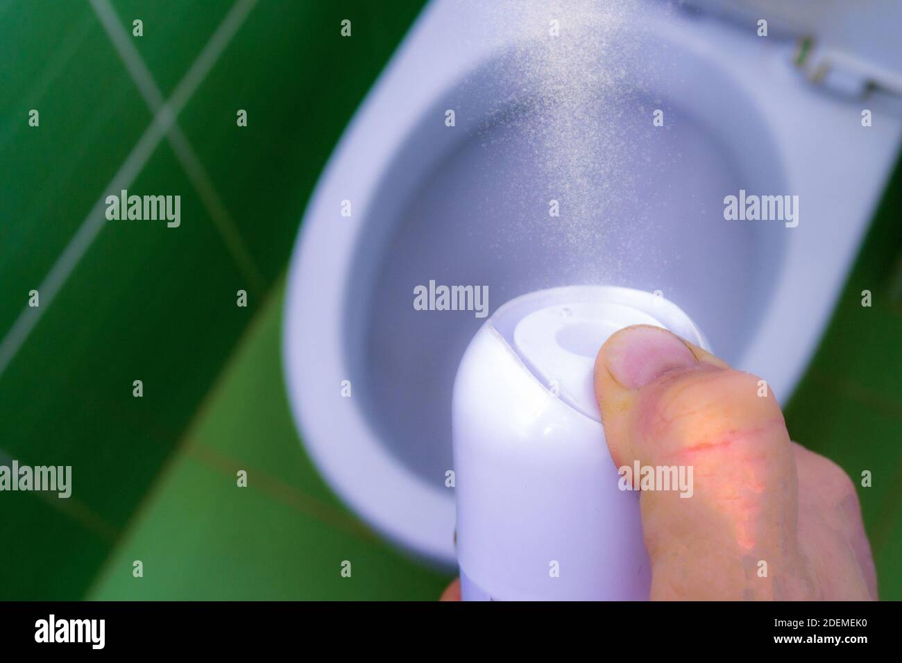 the air freshener sprays a refreshing liquid from a ca Stock Photo - Alamy