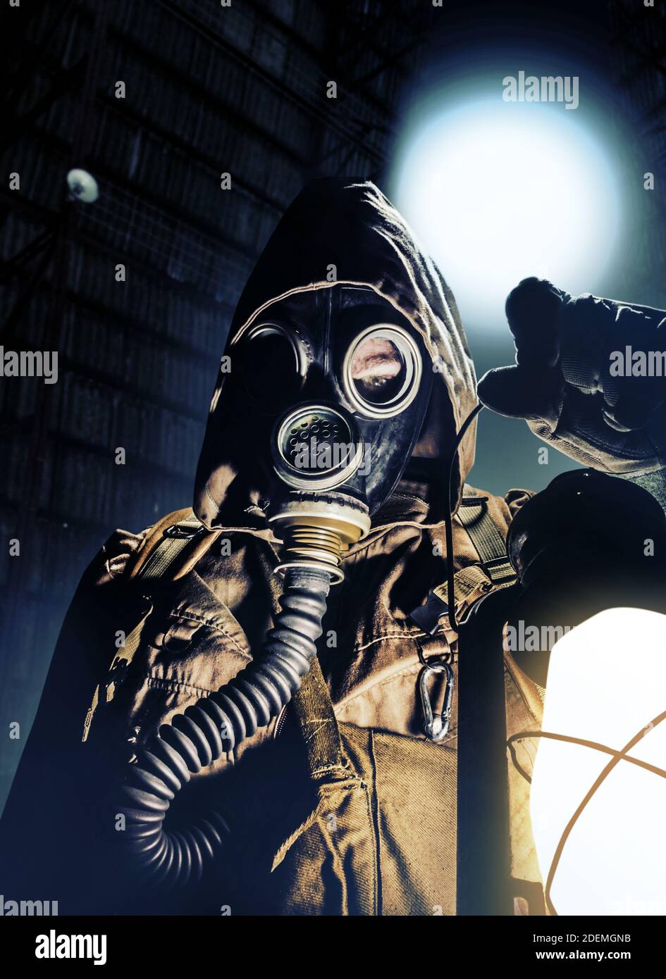 Stalker warrior in protective soviet gas mask holding gasoline lantern ...