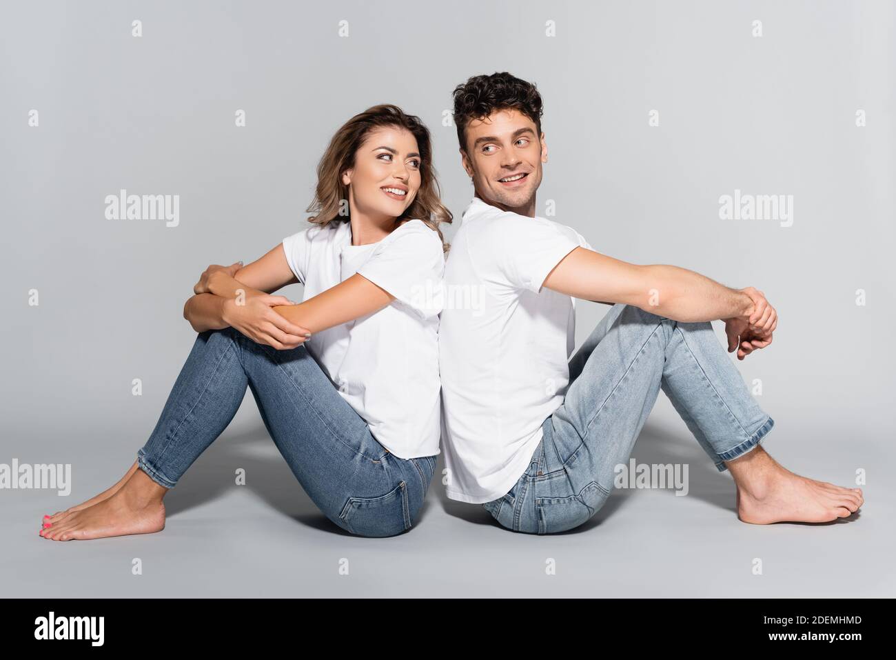 Fashion couple posing back back hi-res stock photography and images - Alamy