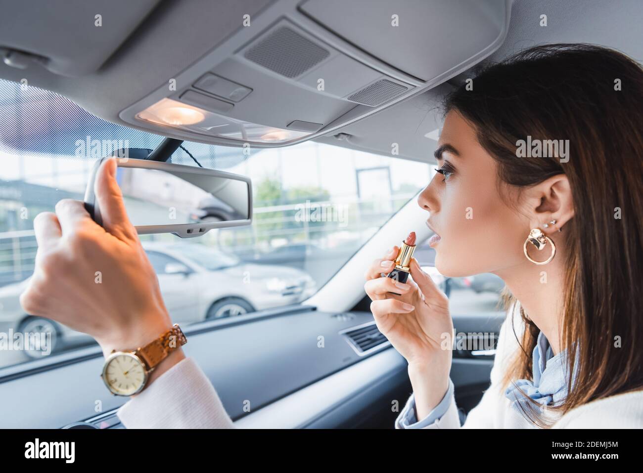 Person looking into the rearview mirror of the car hi-res stock ...