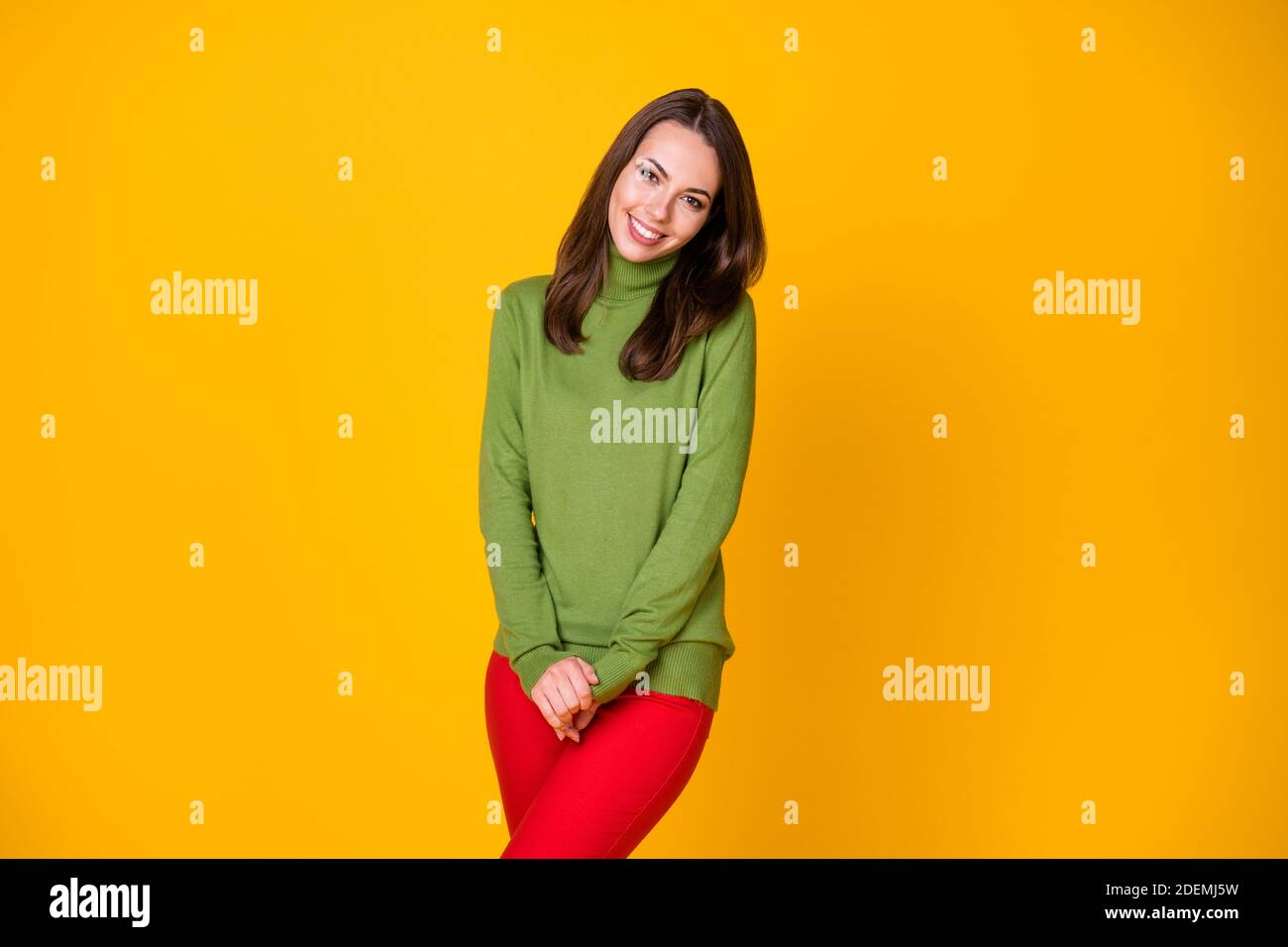 Portrait of attractive shy cheery girl wearing cosy clothing posing ...