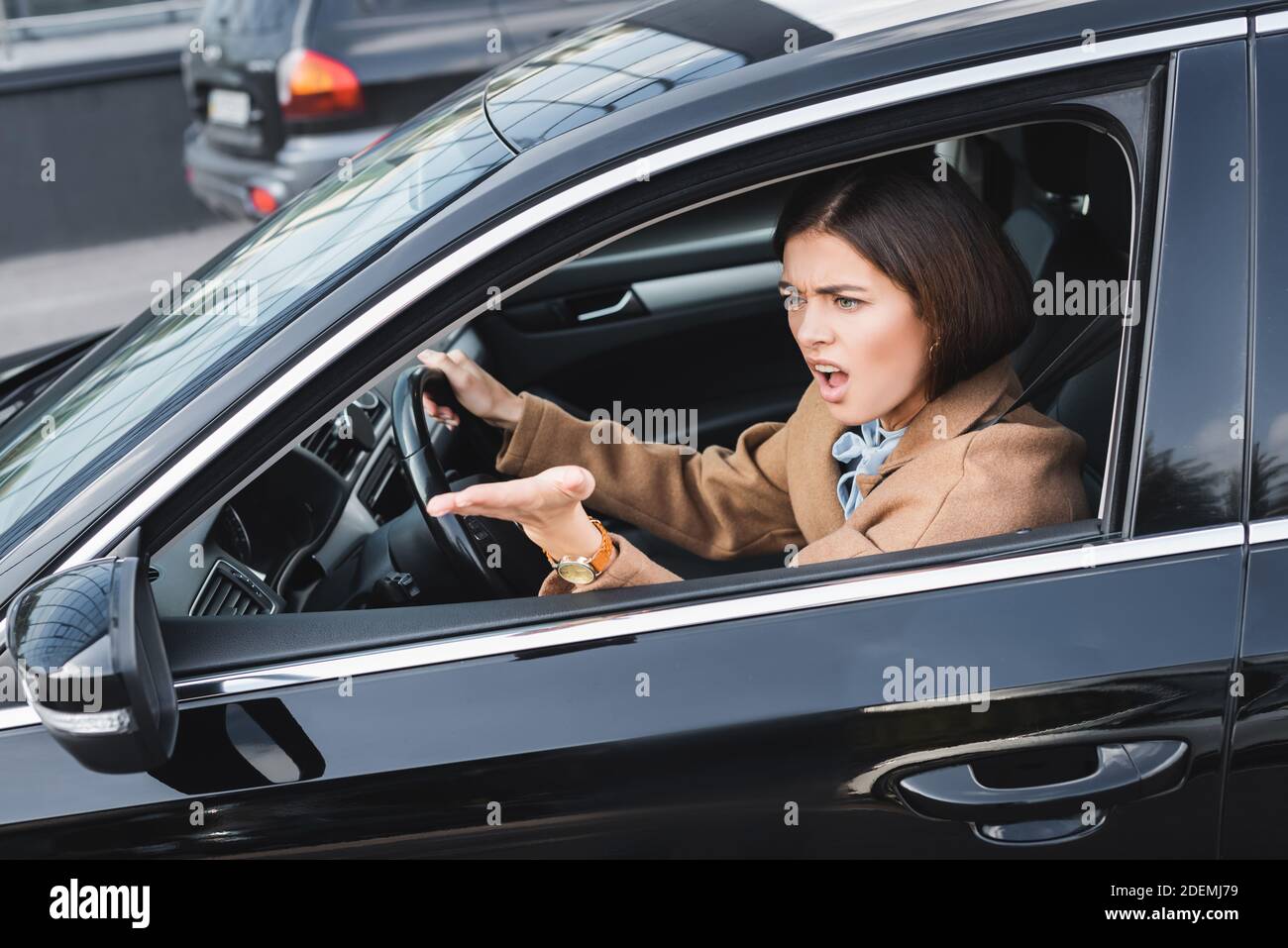 Angry woman driving car hi-res stock photography and images - Alamy