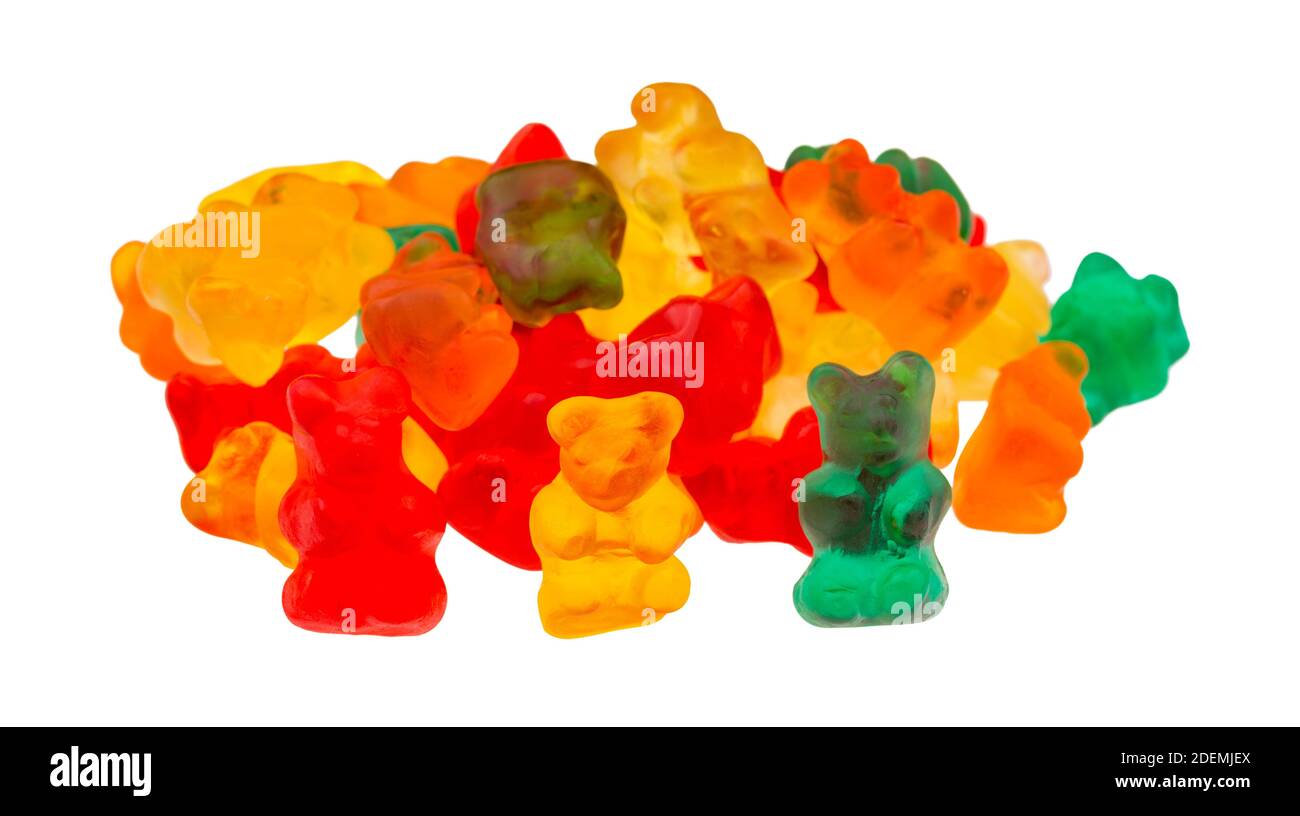 Side view of a pile of colorful gummi bear sugar candies isolated on a ...