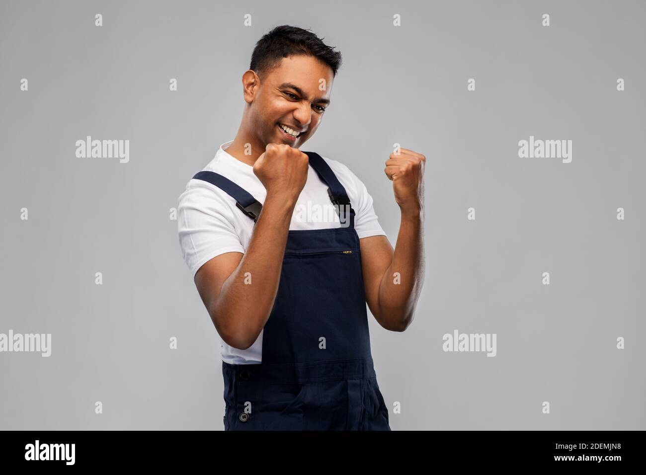 happy indian worker or builder celebrating success Stock Photo - Alamy
