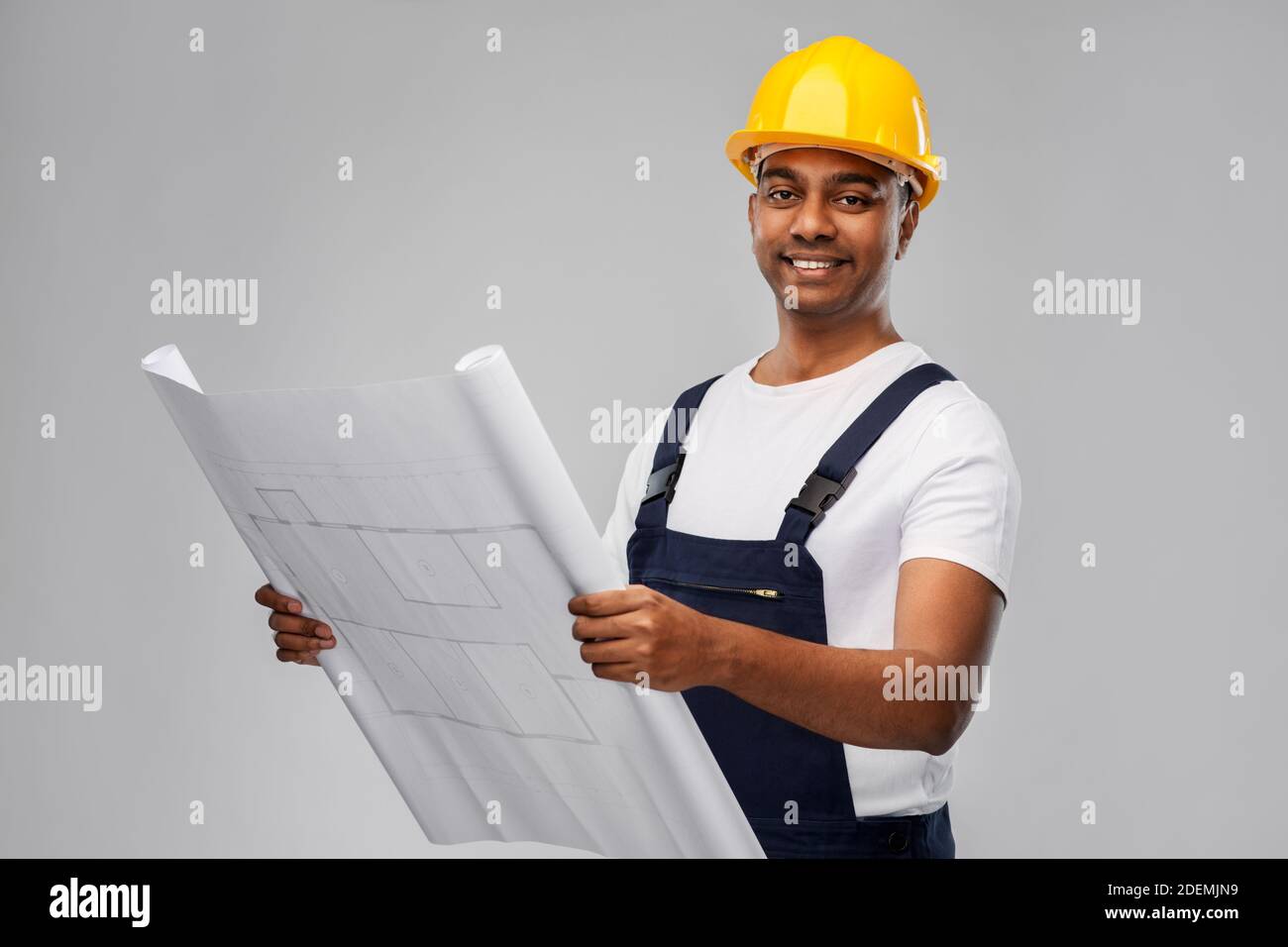 happy indian builder in helmet with blueprint Stock Photo - Alamy
