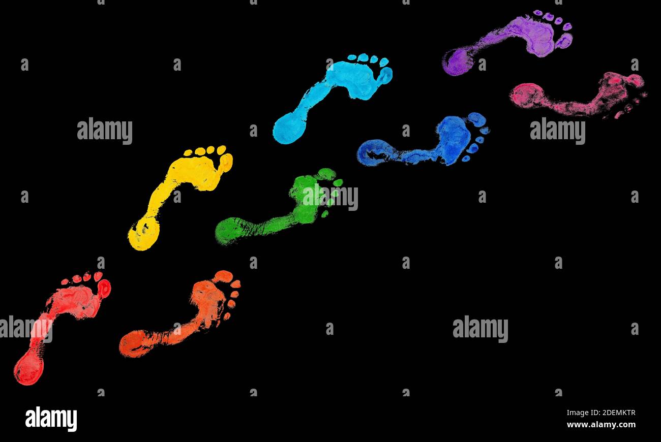 Rainbow color human footprints way black background isolated, colorful ...