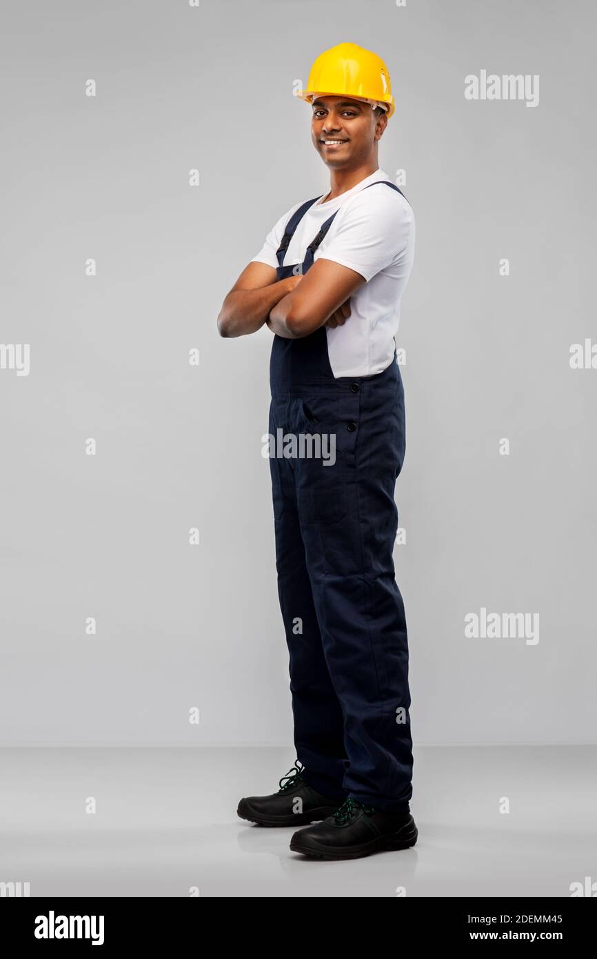 happy indian worker or builder with crossed arms Stock Photo - Alamy