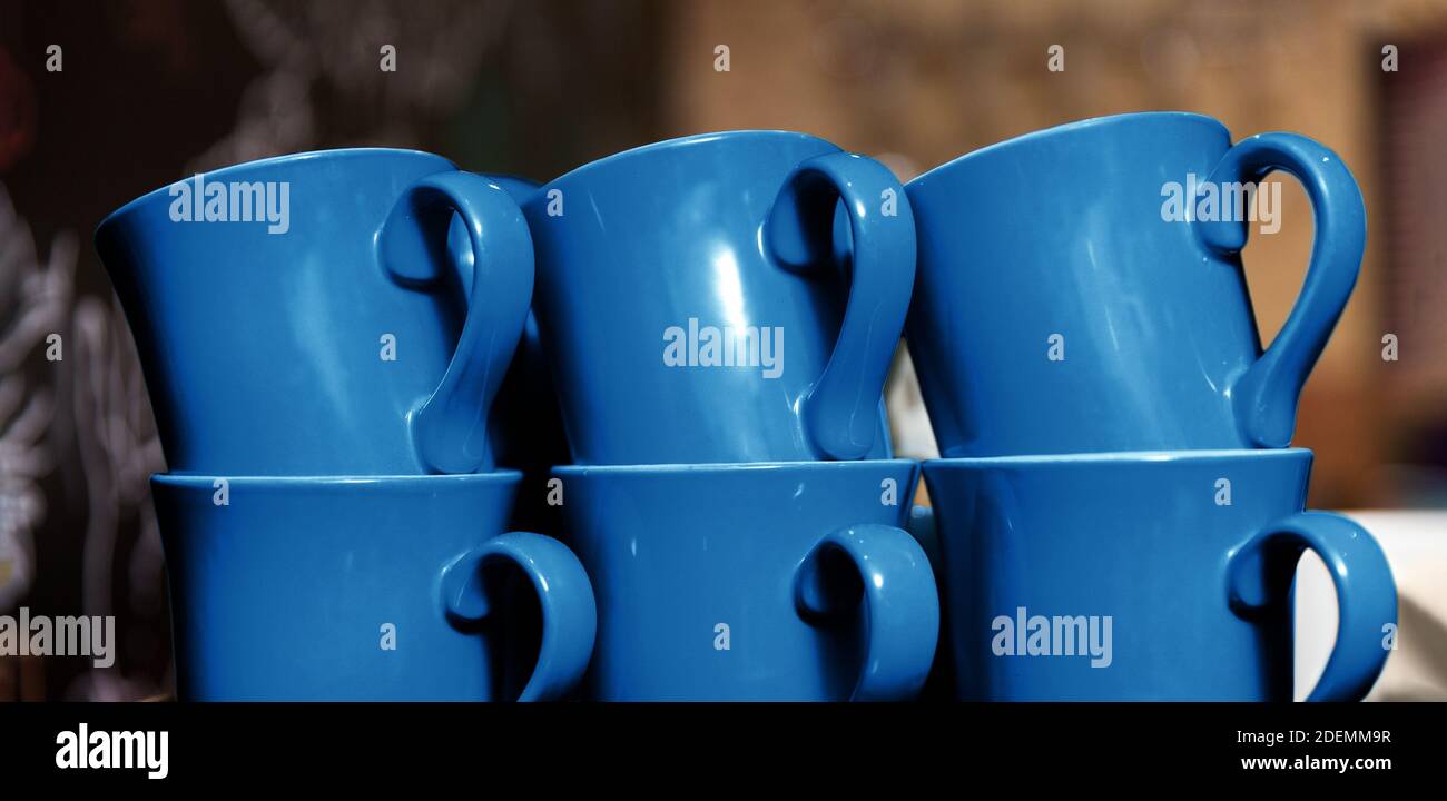 stacked cups in classic blue color of year 2020 Stock Photo - Alamy