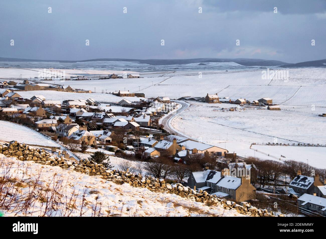 Aerial view of scottish town in winter with hills in distant background ...