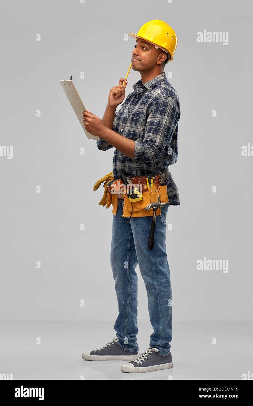 thinking builder with clipboard and pencil Stock Photo - Alamy