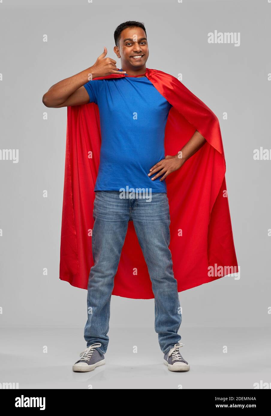 indian man in superhero cape making call gesture Stock Photo - Alamy