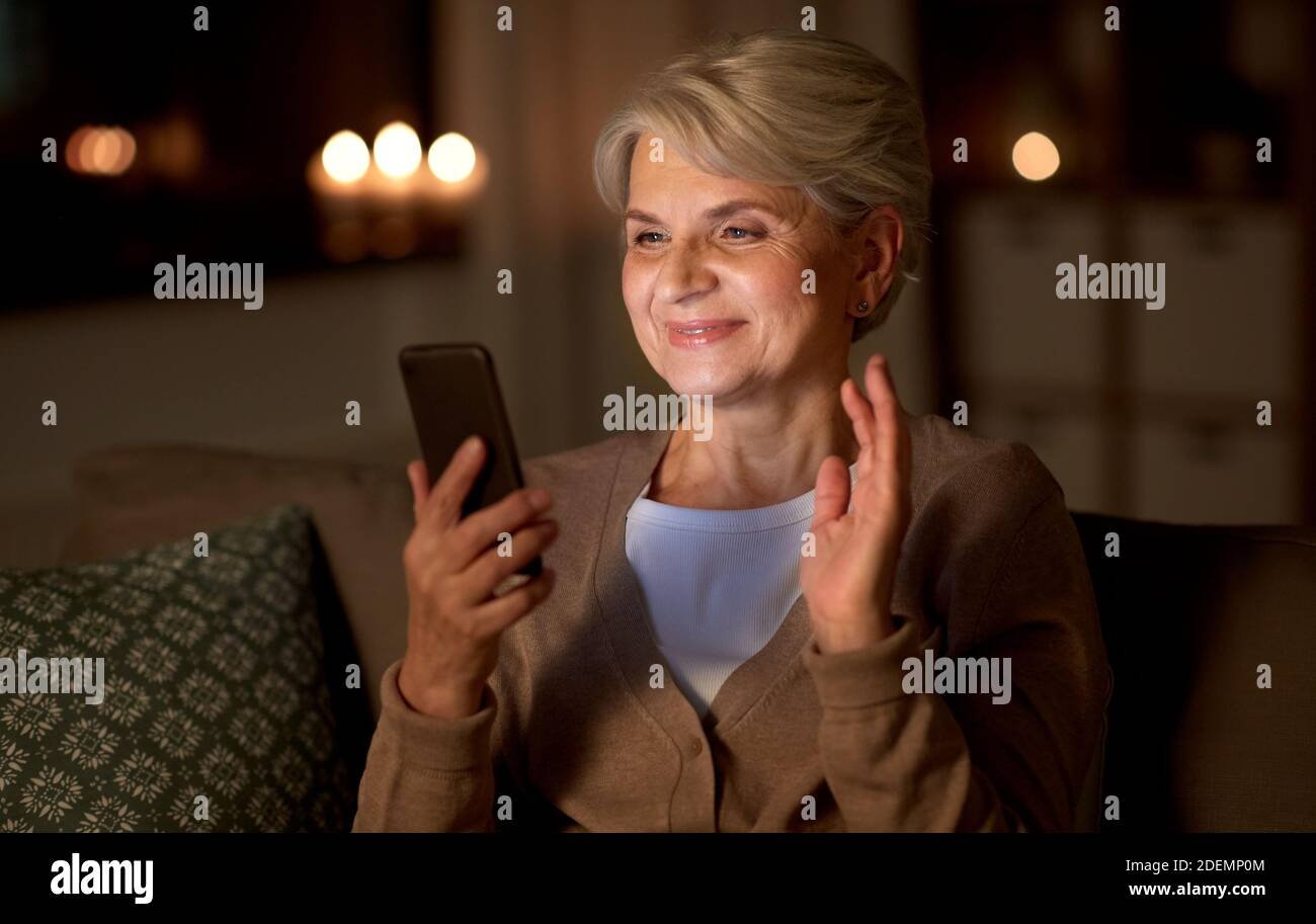 Senior woman phone call night hi-res stock photography and images - Alamy