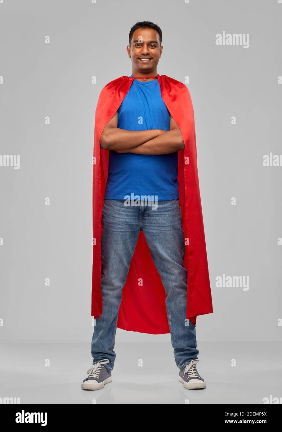 indian man in red superhero cape with arms crossed Stock Photo - Alamy