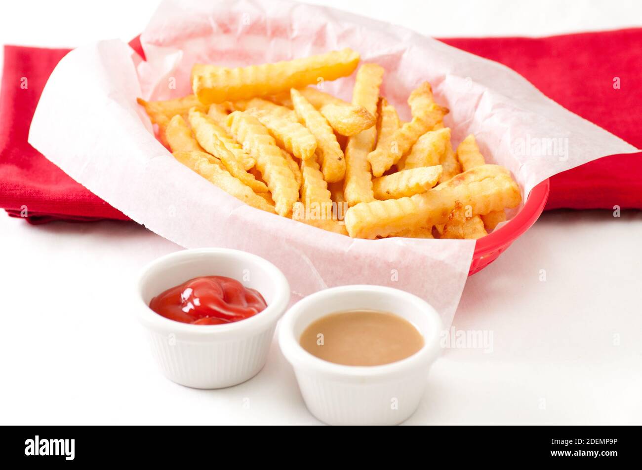 crispy crinkle cut french fries with gravy and ketchup Stock Photo - Alamy