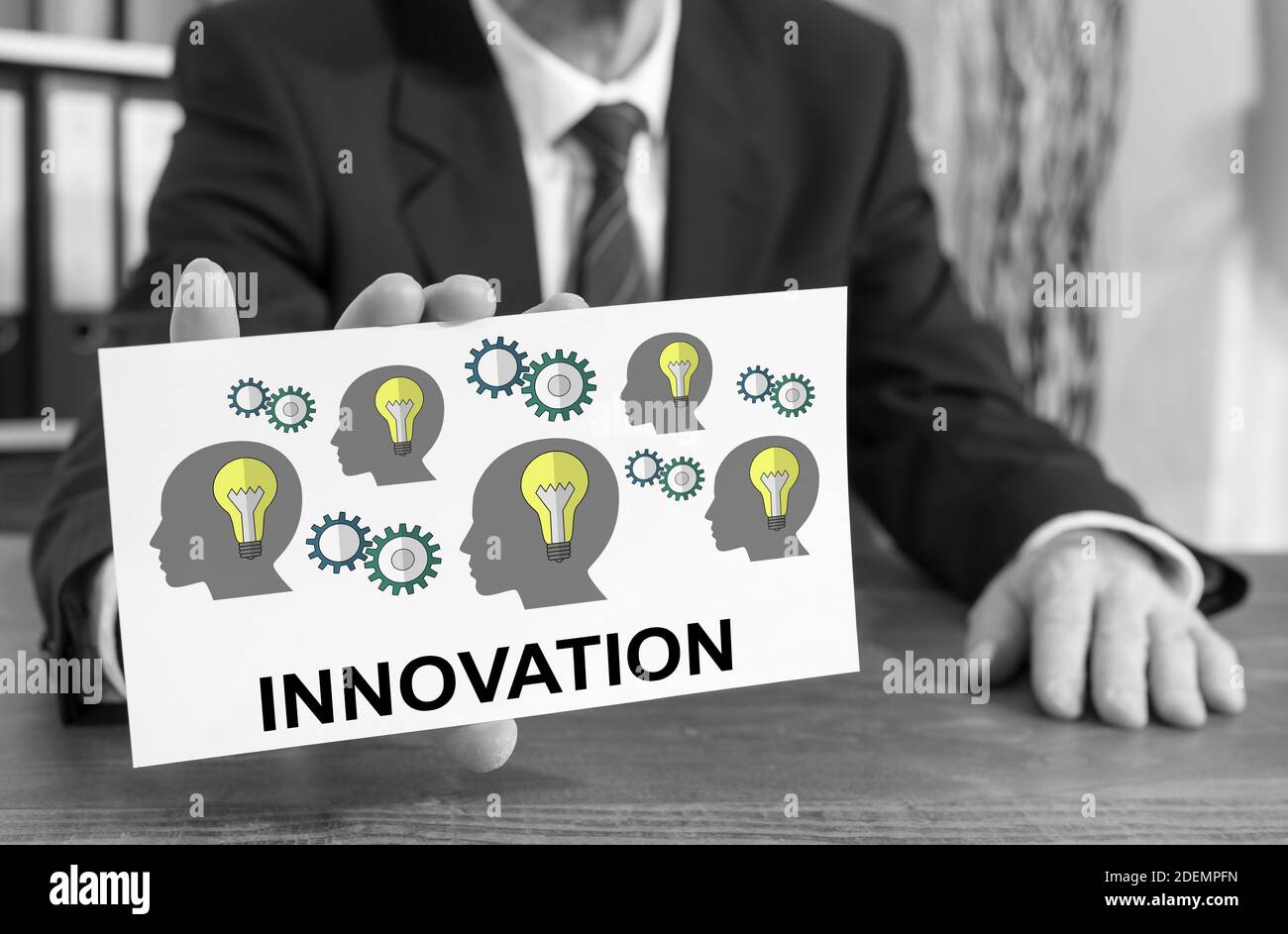 Businessman showing an index card with innovation concept Stock Photo ...