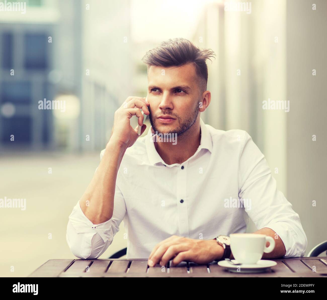 man with coffee calling on smartphone at city cafe Stock Photo - Alamy