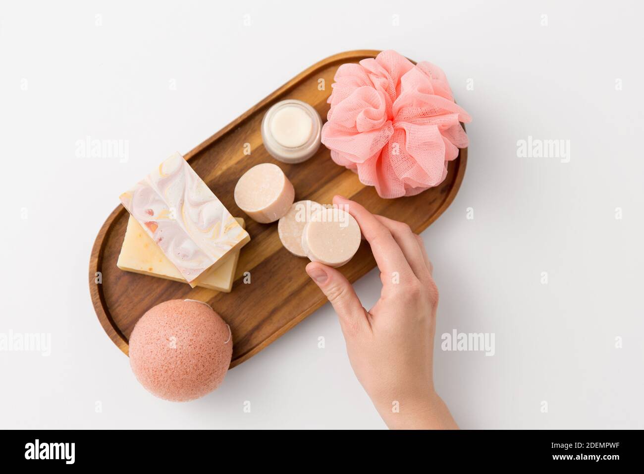 hand with soap, sponge, moisturizer and wisp Stock Photo - Alamy
