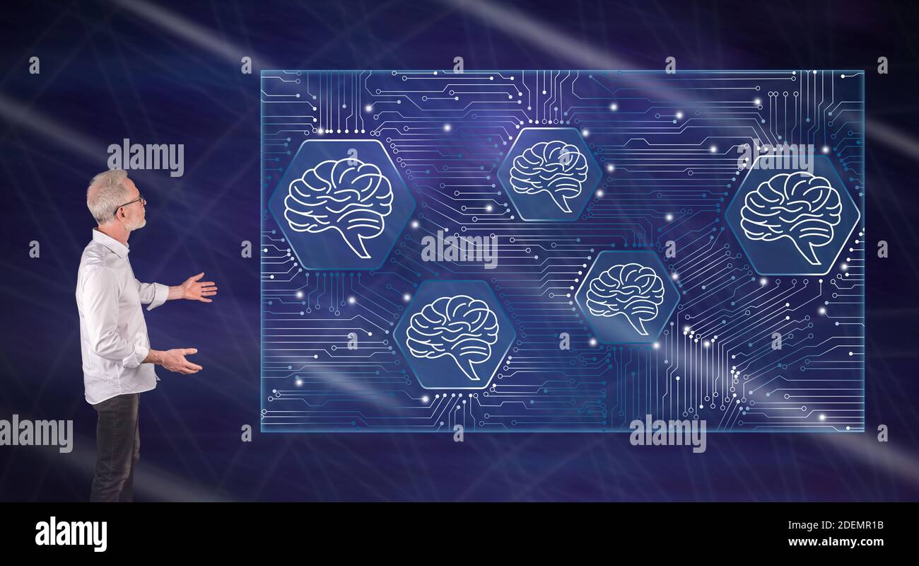 Businessman showing an artificial intelligence concept on a wall screen ...