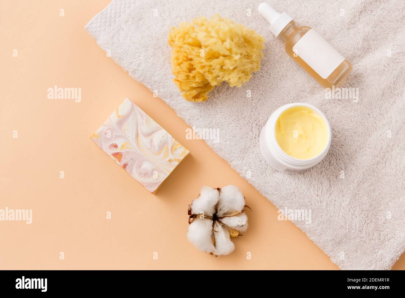 body butter, essential oil, sponge on bath towel Stock Photo - Alamy