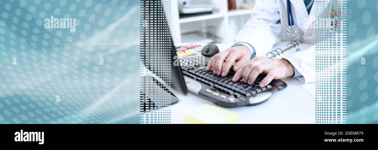 Doctor typing on a computer keyboard at office; panoramic banner Stock ...