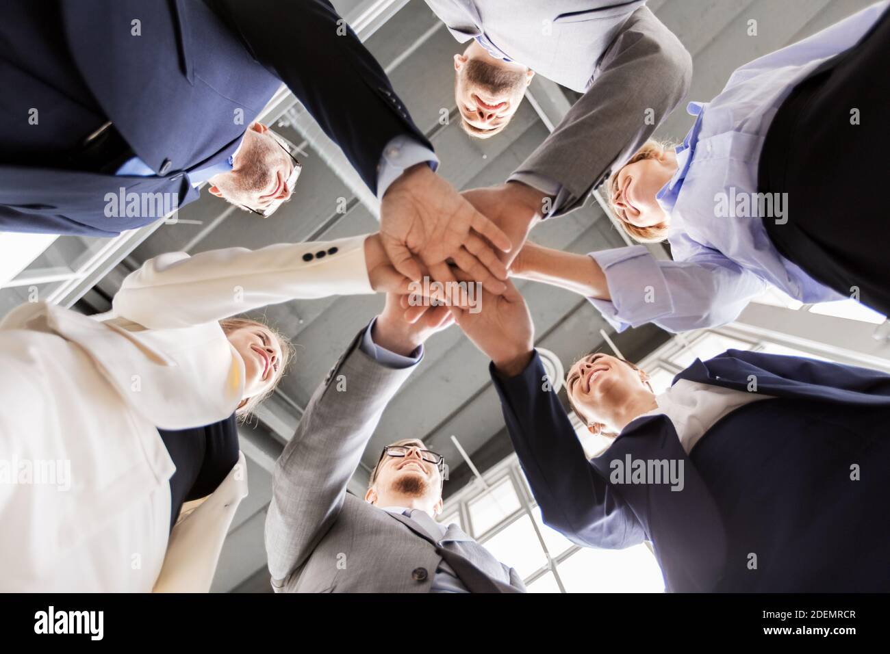 Business people stacking hands hi-res stock photography and images - Alamy