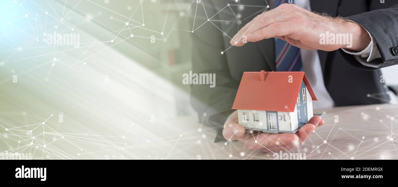 Insurance agent protecting house with his hands; multiple exposure ...