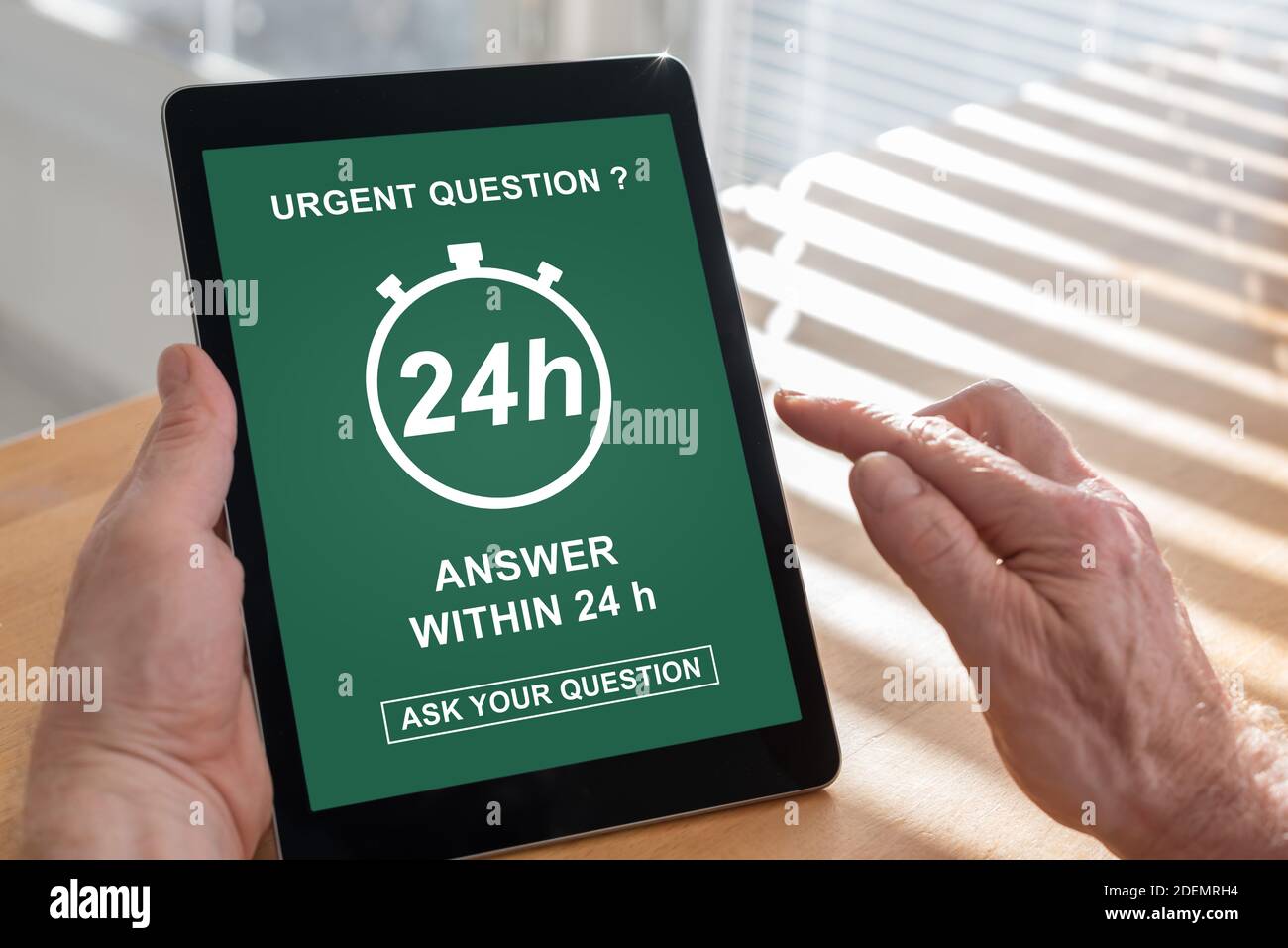 Tablet screen displaying an urgent question concept Stock Photo - Alamy