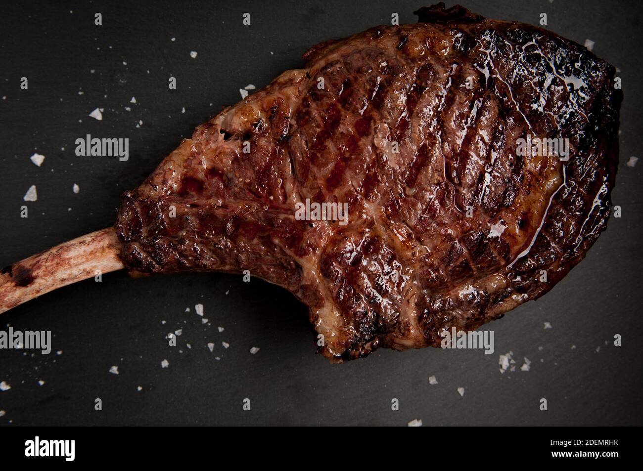 beautifully seared tomahawk steak, medium rare to rare Stock Photo - Alamy