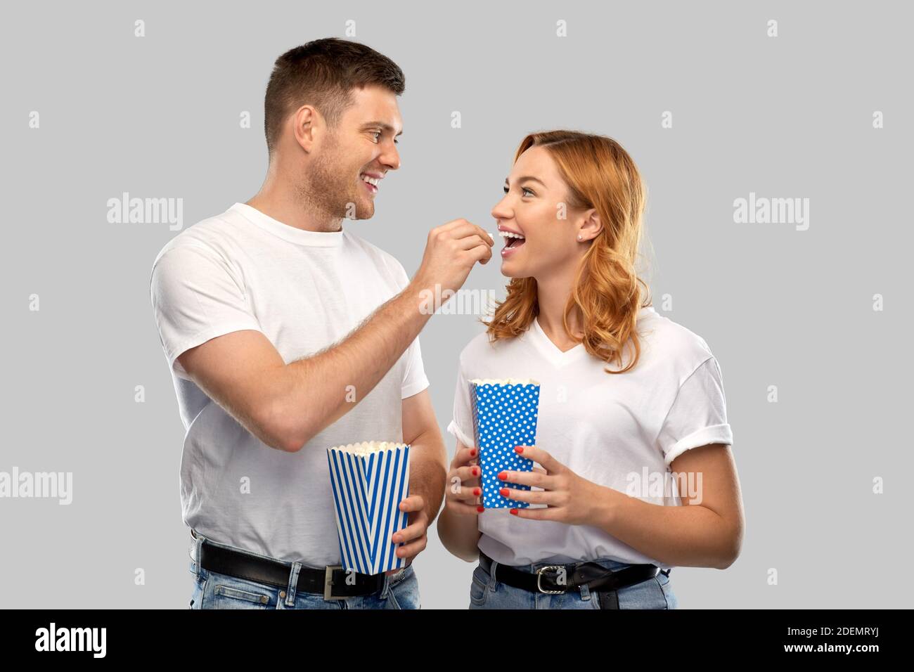 Happy lovely couple eating popcorn hi-res stock photography and images ...