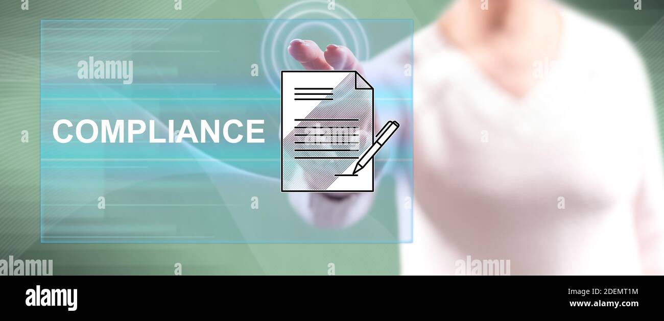 Woman touching a compliance concept on a touch screen with her fingers ...